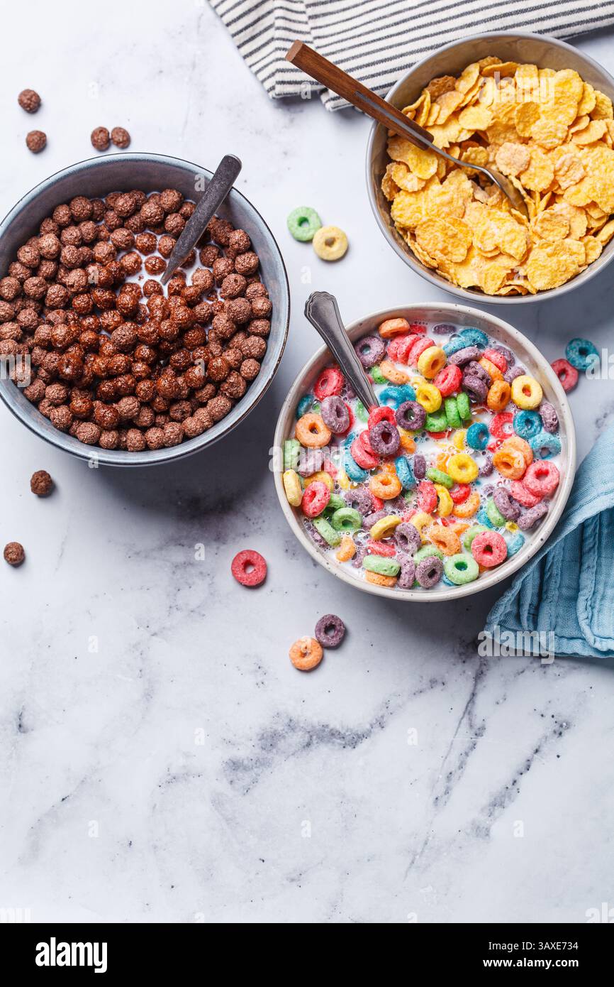 Different types of breakfast cereals background. Chocolate balls ...