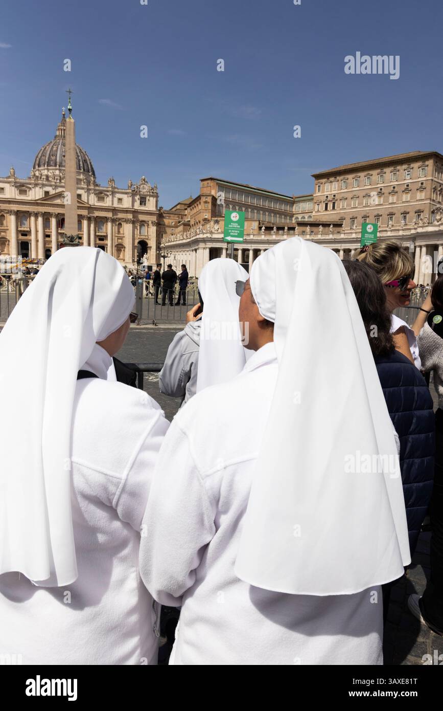 Pope Francis dies at the Vatican Nuns stand at St.Peter Square after ...