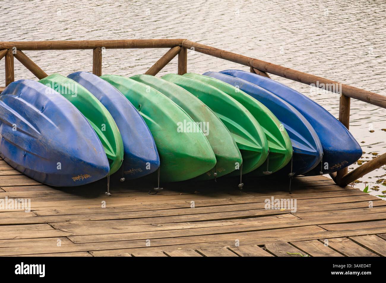 A stack of plastic kayaks on a dock at the Sonso Lagoon Nature Reserve ...