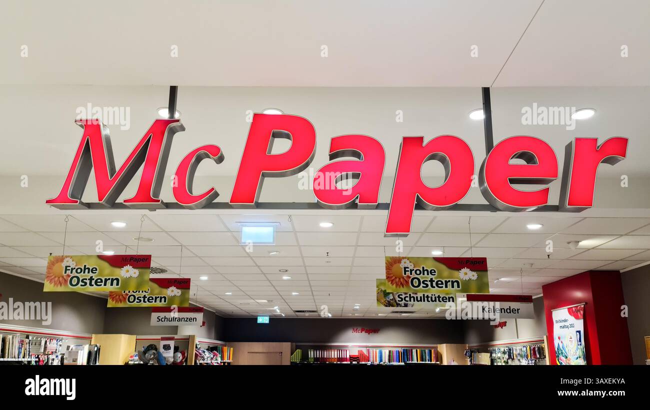 Kiel, Germany - 19. April 2025: Red McPaper illuminated sign hanging ...