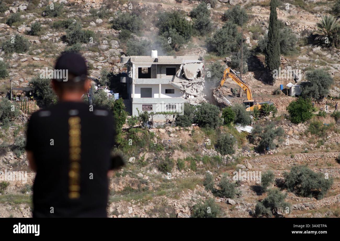 Ramallah, West Bank city of Ramallah. 21st Apr, 2025. A man watches as ...
