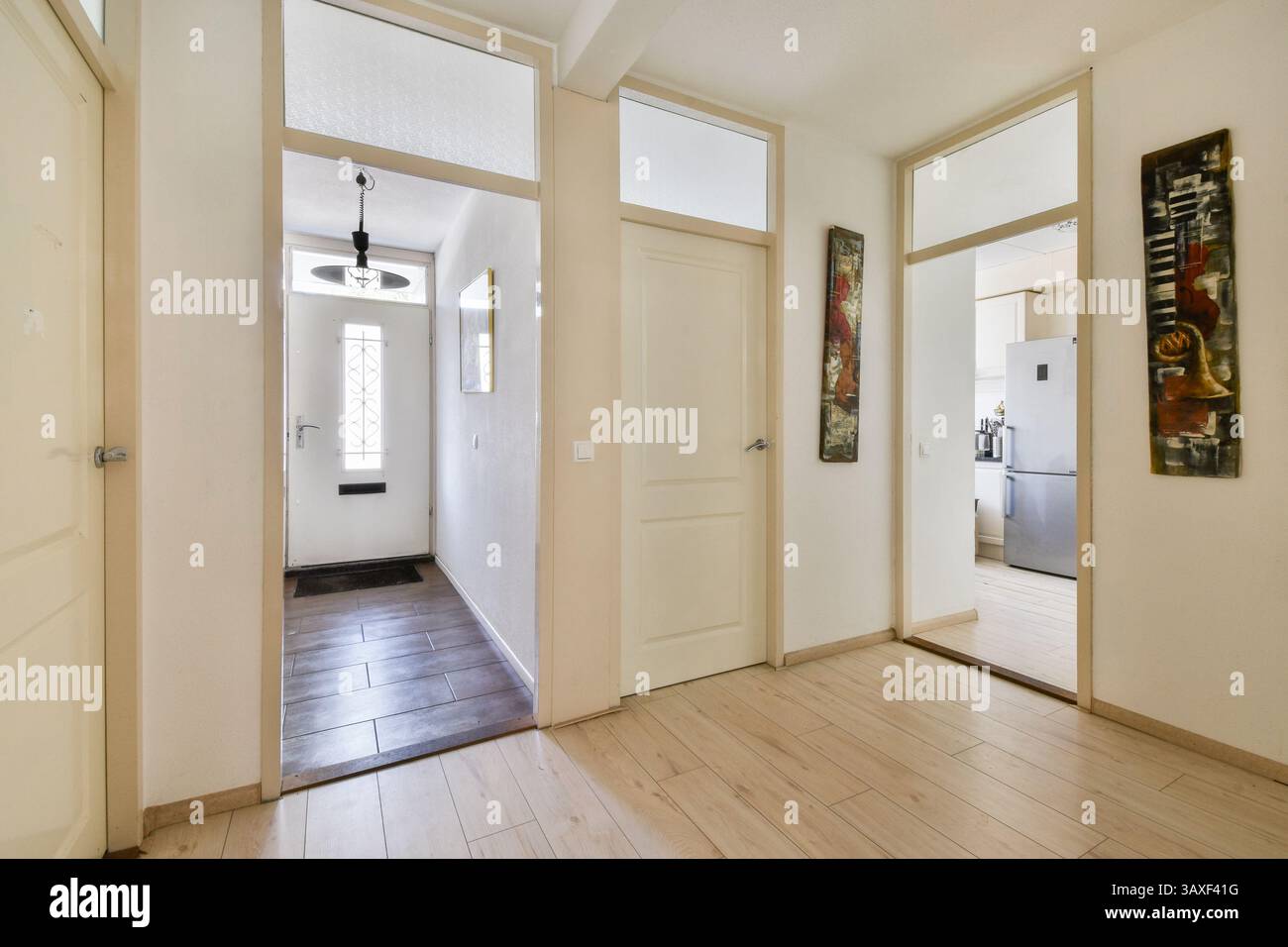 An elegantly designed modern interior hallway featuring light colors ...