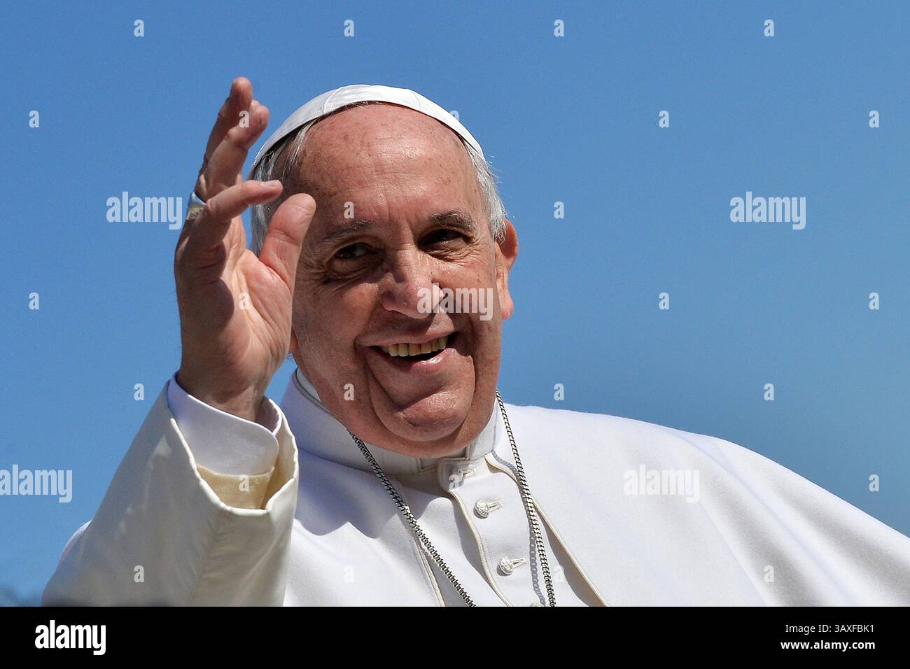 Pope Francis waves during a general audience in St. Peter's square at ...