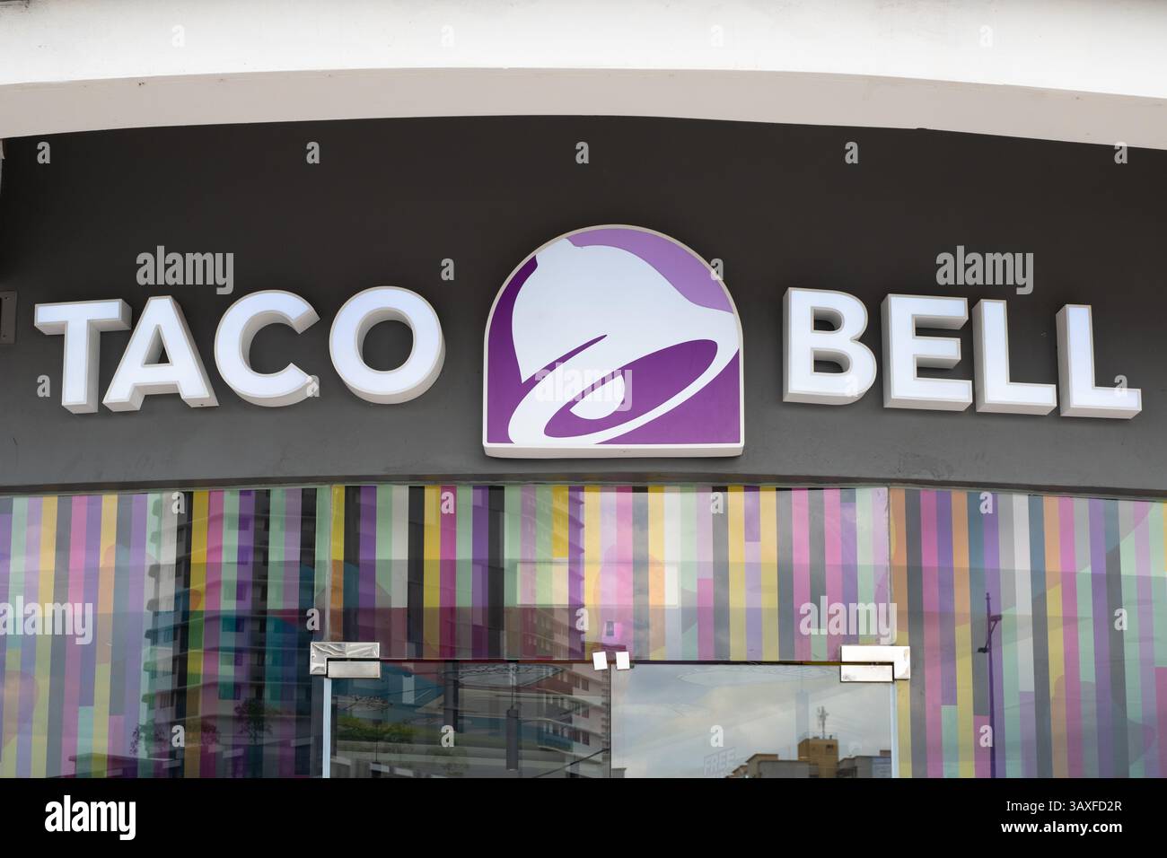 Taco Bell restaurant exterior with vibrant colors showcasing fast food culture and dining ...