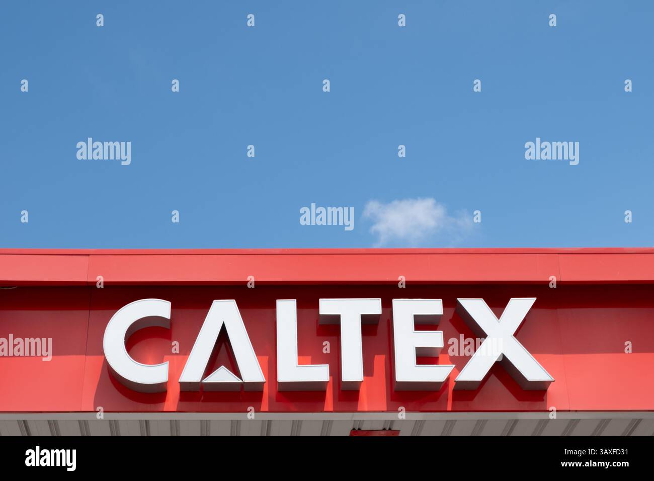 Caltex brand signage against a clear blue sky showcasing modern design ...