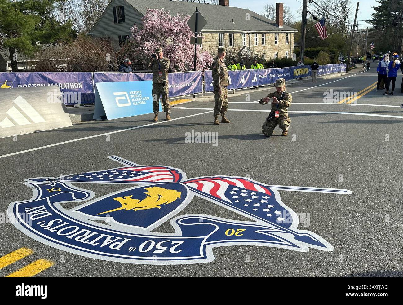 Massachusetts Army National Guard Cadet Meghan Drysdale kneels to take ...