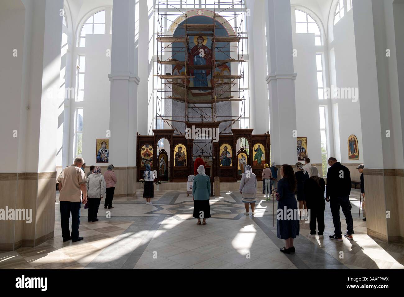 Bucha, Ukraine. 21st Apr, 2025. People attend the Easter Monday ...