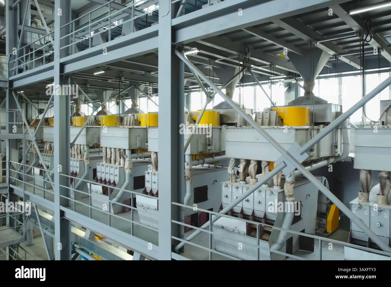 Sifting rice in the factory. Rice sieving conveyor Stock Photo - Alamy