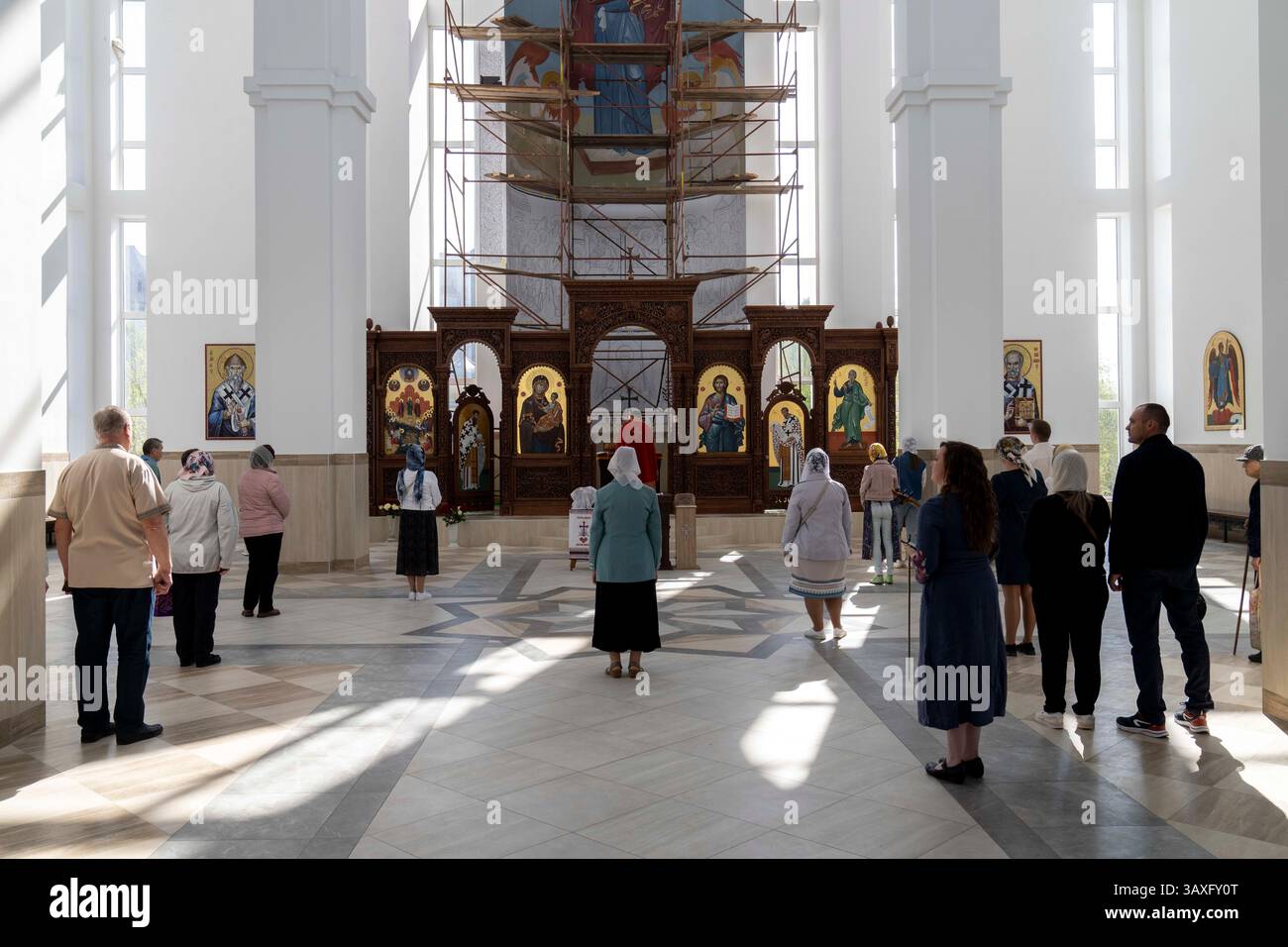 Bucha, Kyiv Oblast, Ukraine. 21st Apr, 2025. People attend the Easter ...