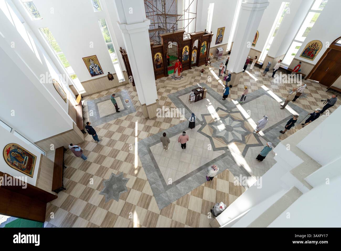 Bucha, Kyiv Oblast, Ukraine. 21st Apr, 2025. People attend the Easter ...