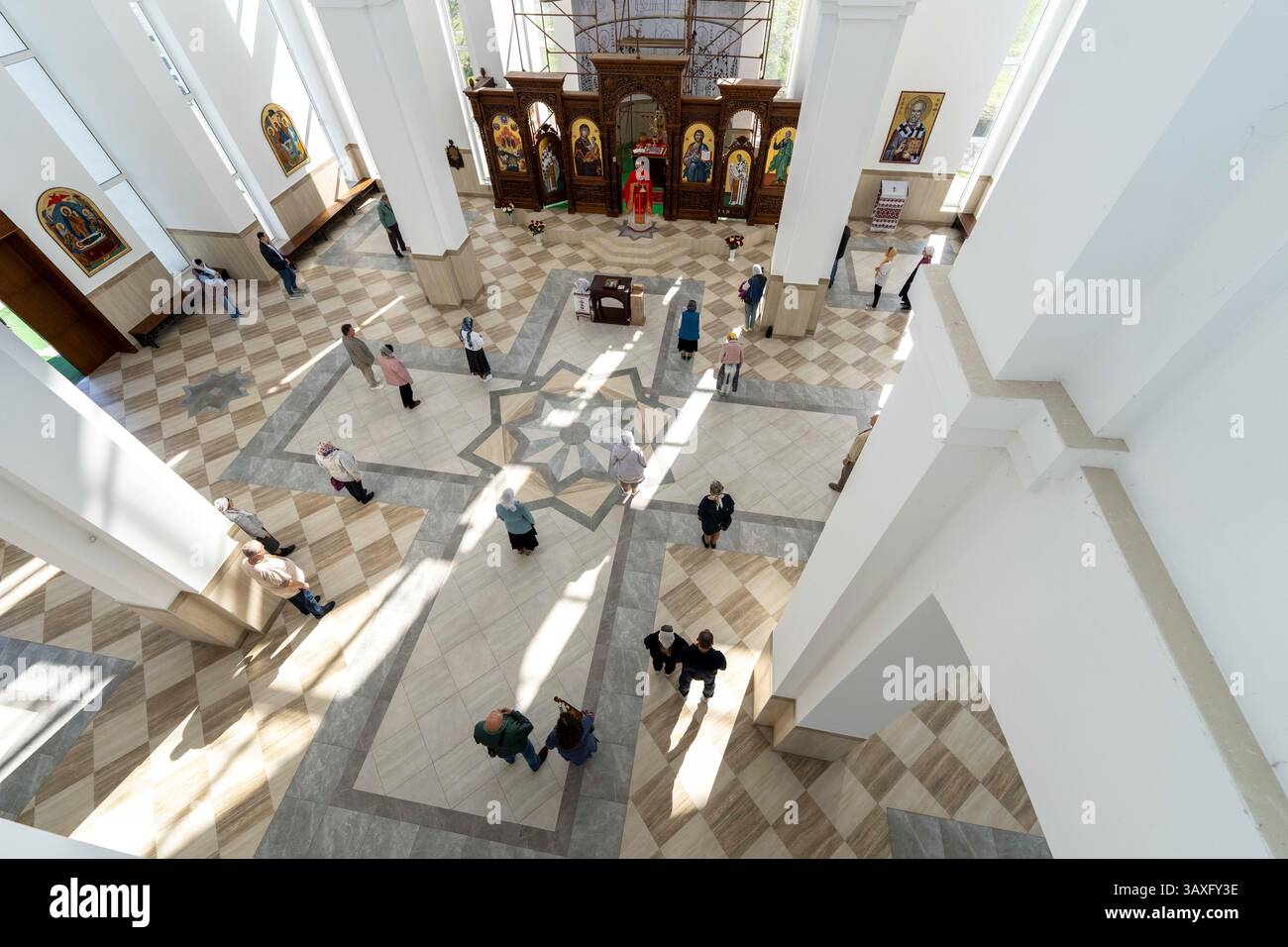 Bucha, Kyiv Oblast, Ukraine. 21st Apr, 2025. People attend the Easter ...