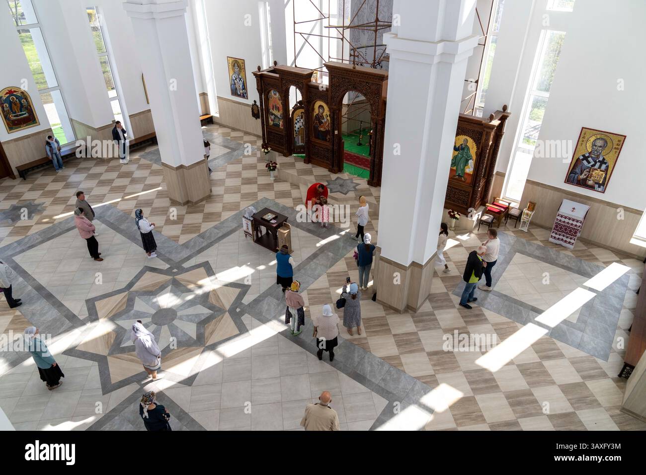 Bucha, Kyiv Oblast, Ukraine. 21st Apr, 2025. People attend the Easter ...