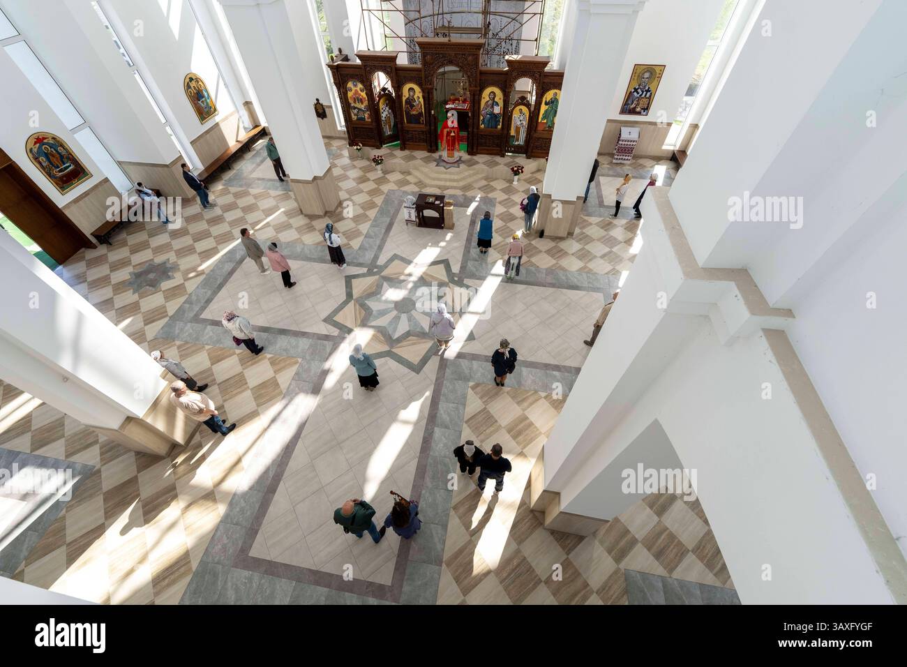 People attend the Easter Monday festivities at Church of St. Andrew and ...
