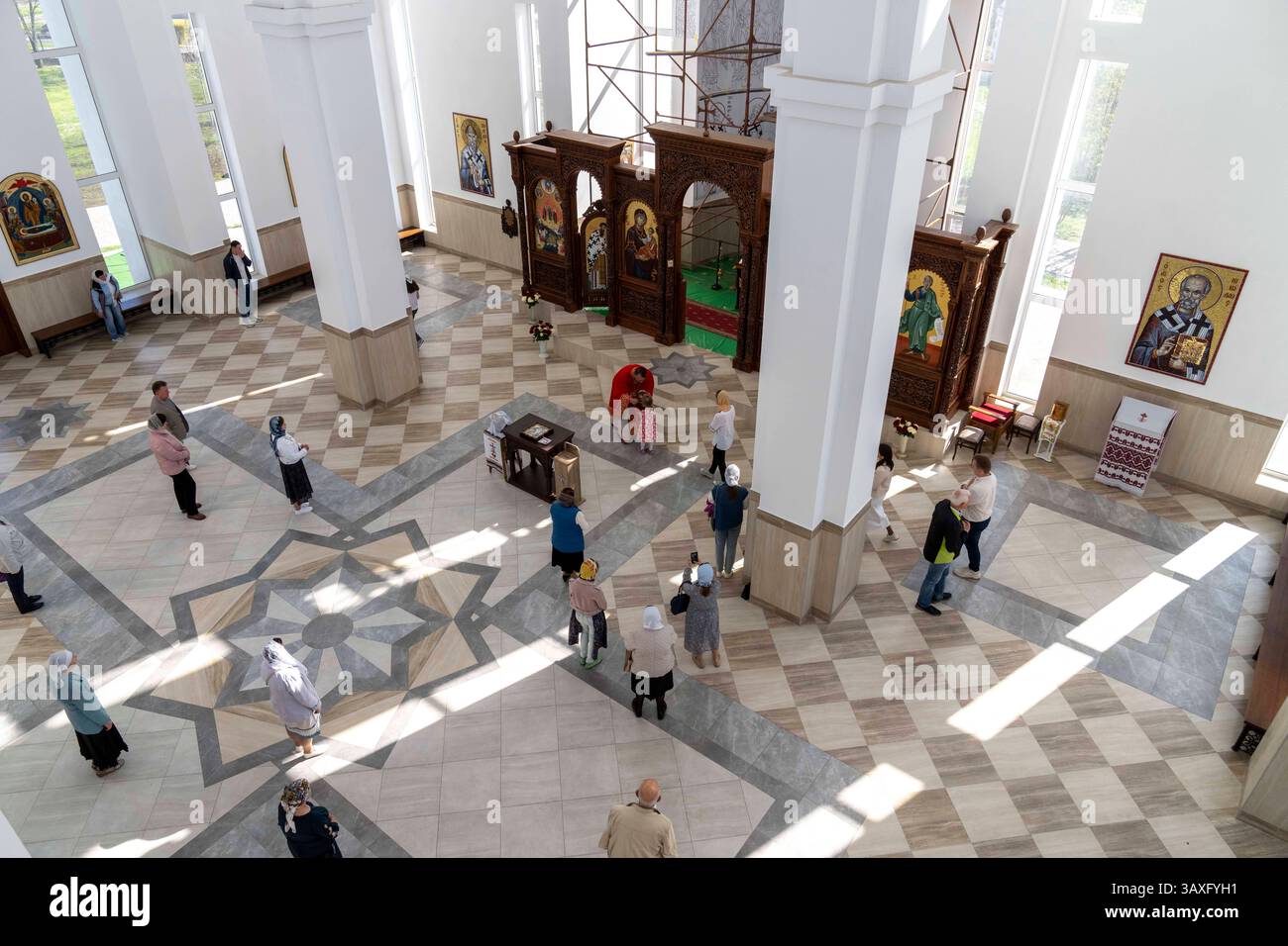 People attend the Easter Monday festivities at Church of St. Andrew and ...