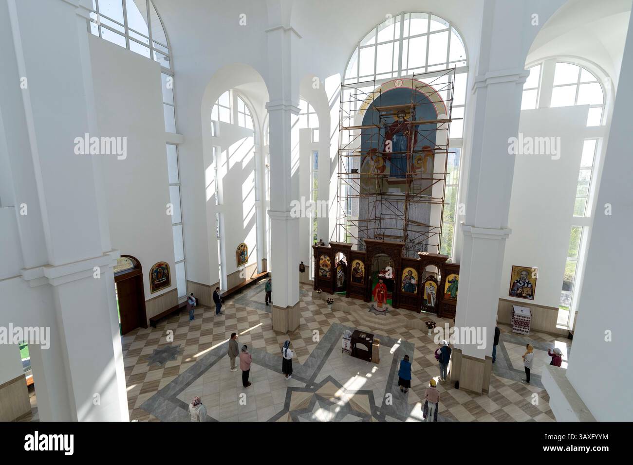 Bucha, Kyiv Oblast, Ukraine. 21st Apr, 2025. People attend the Easter ...