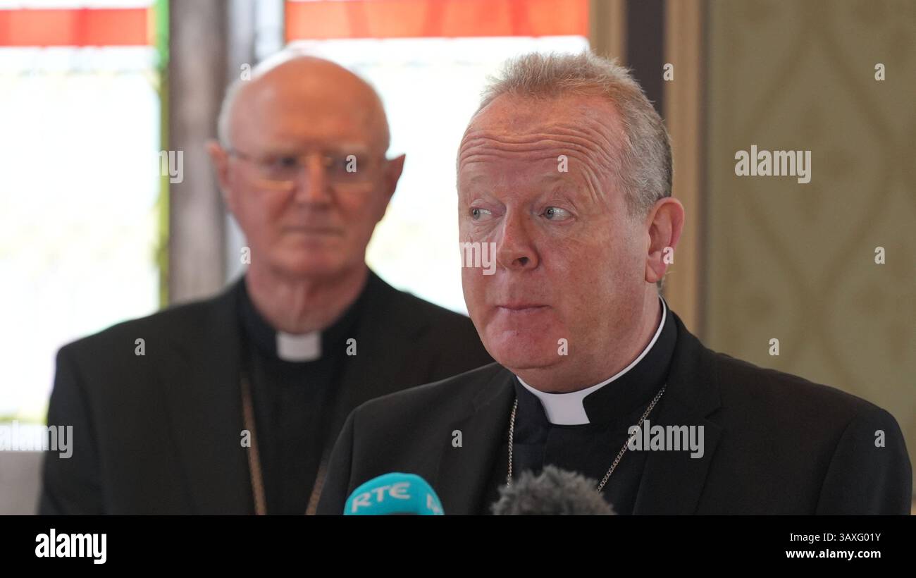 The Archbishop of Armagh, Eamon Martin, watched by Archbishop Dermot ...