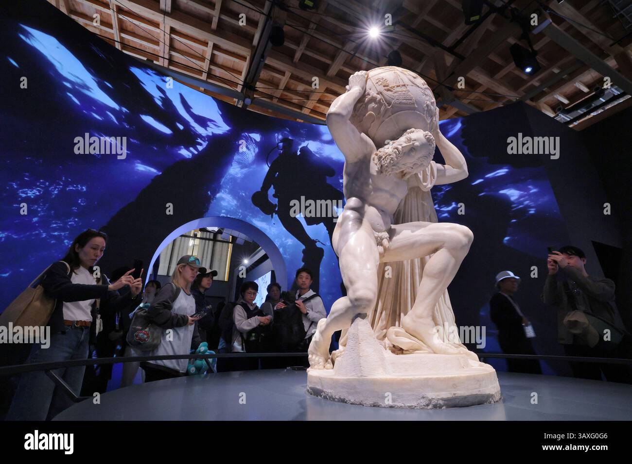 A photo shows the marble statue of the "Farnese Atlas," known as a ...