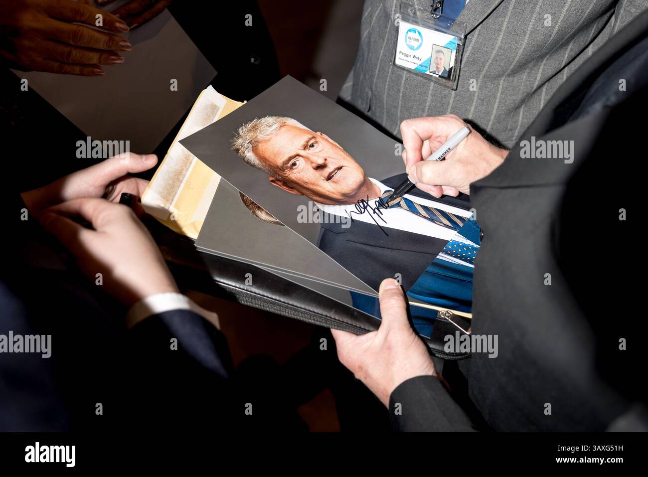 Reform UK Member of Parliament for Ashfield Lee Anderson signs his ...