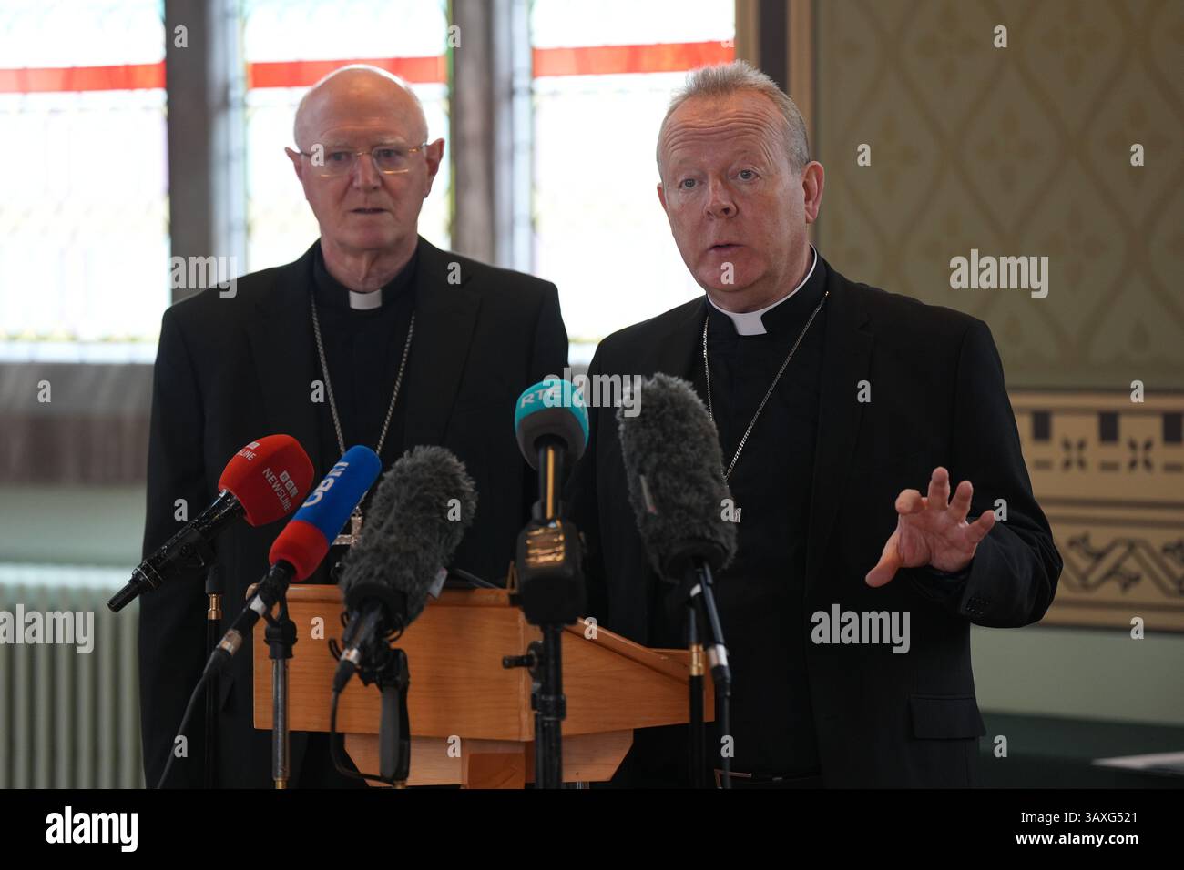 The Archbishop of Armagh, Eamon Martin, watched by Archbishop Dermot ...