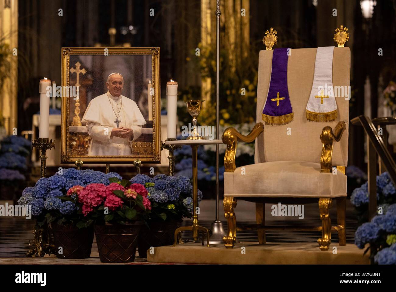 A picture of Pope Francis is displayed at St. Patrick's Cathedral ...