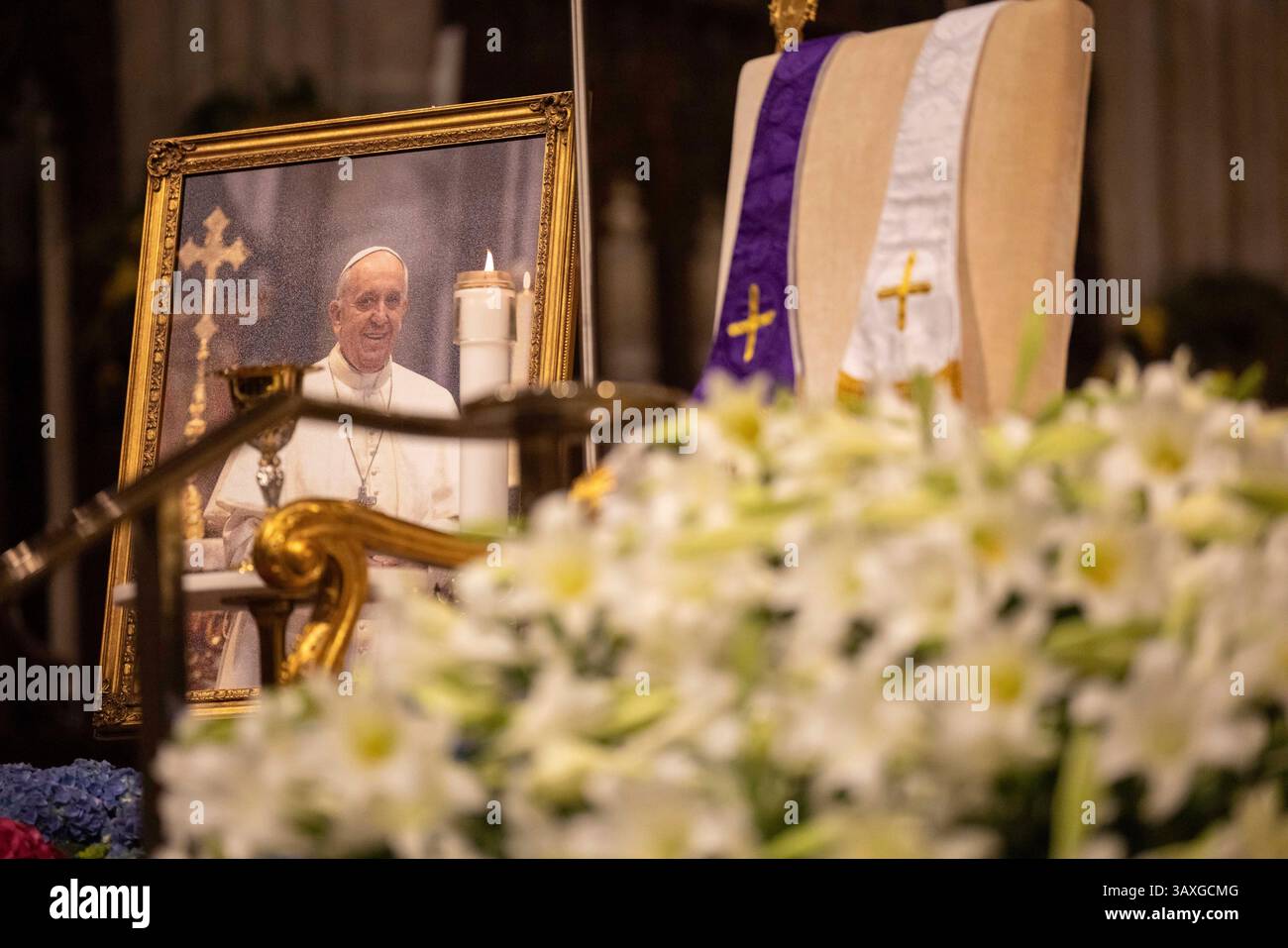 A picture of Pope Francis is displayed at St. Patrick's Cathedral ...