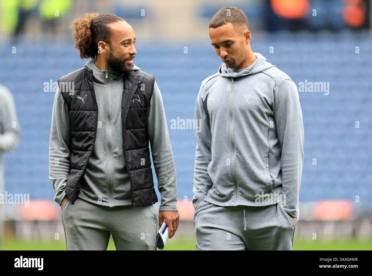 Derby County's Marcus Harness (left) and Kane Wilson inspect the pitch ...
