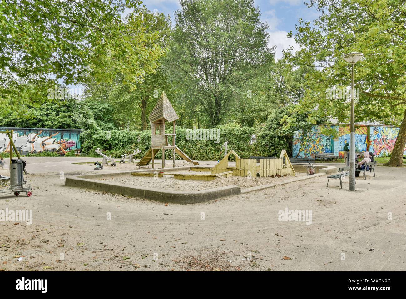 The scene features a playground with a play structure, benches, and ...
