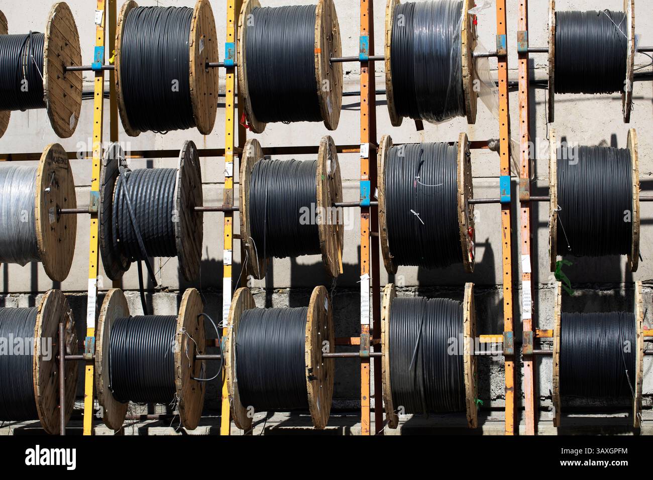 Vertical storage of industrial electric cable reels in rows at a ...