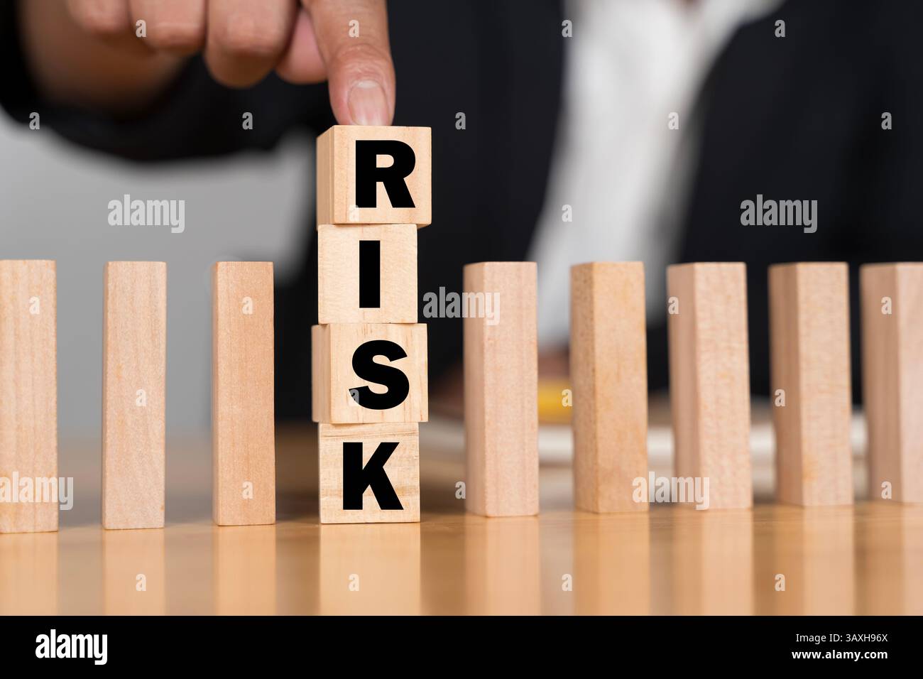 Businessman Stop Domino Effect. Risk Management and Insurance Concept ...