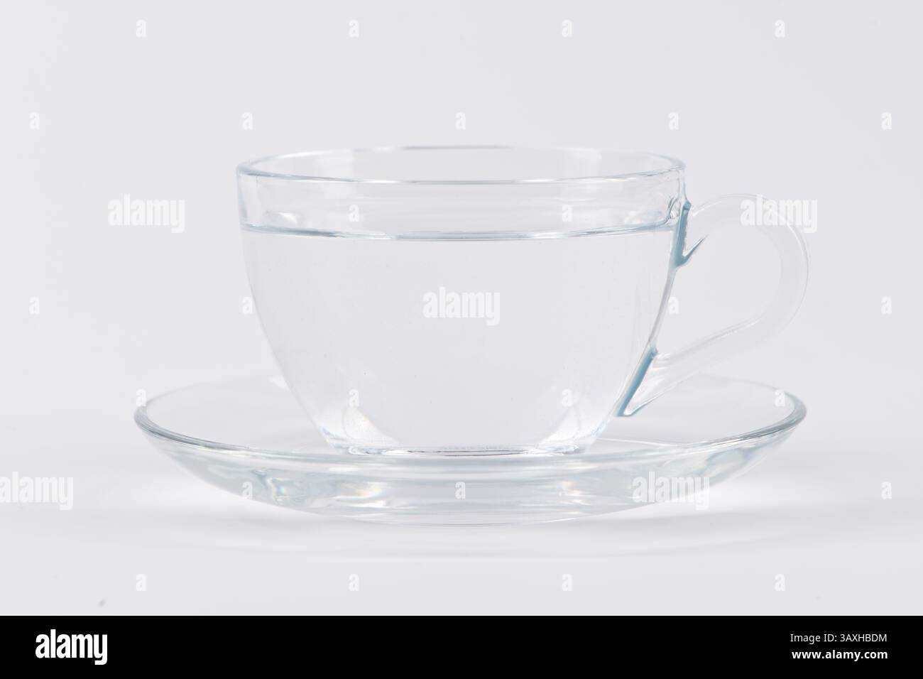 Cup of water on white background Stock Photo - Alamy