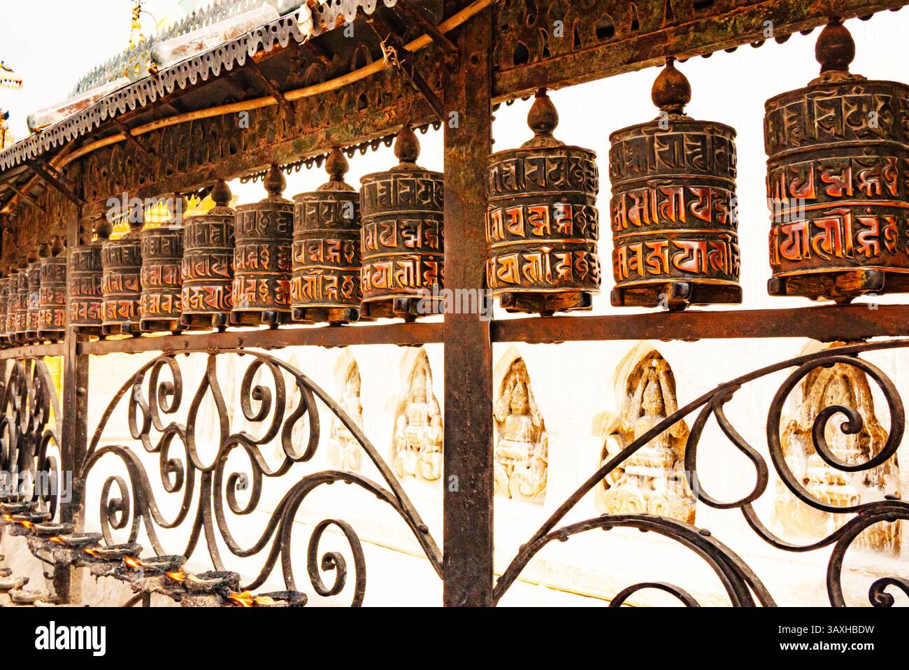 Traditional Tibetan prayer wheels in a Buddhist temple. Close-up of ...