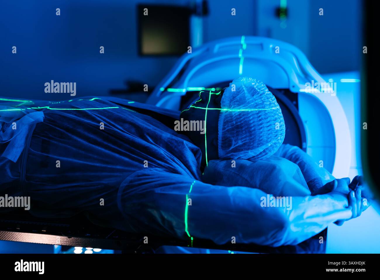 A young man undergoing radiation therapy for cancer in a state-of-the ...