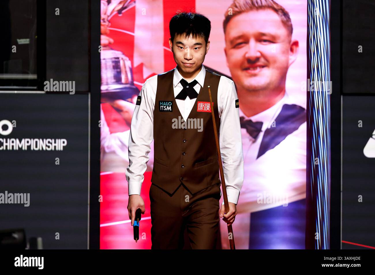 Fan Zhengyi smiles as he enters the arena of play during the 2025 Halo World Snooker ...