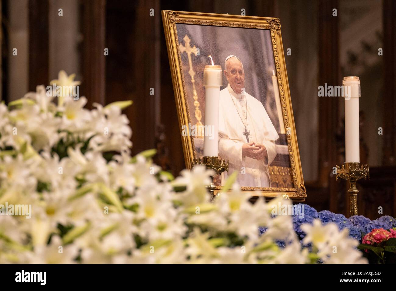 A picture of Pope Francis is displayed at St. Patrick's Cathedral ...