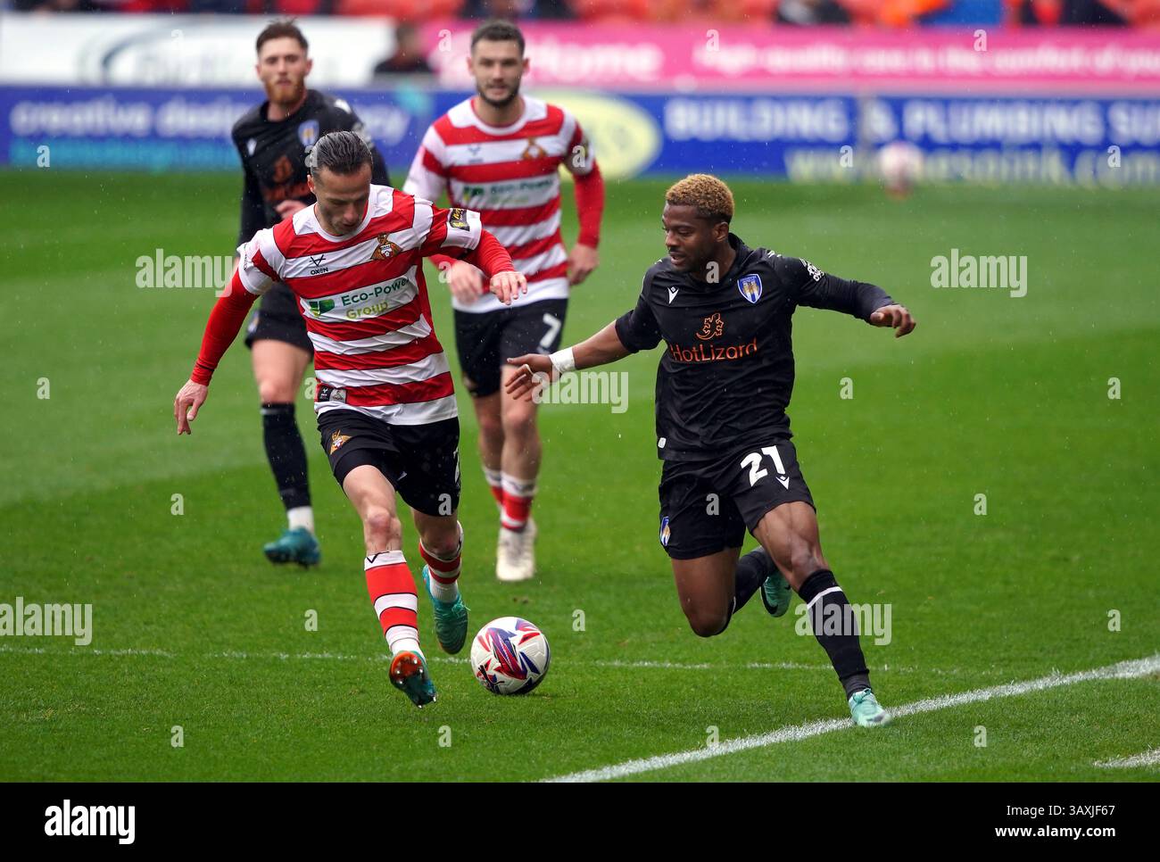Doncaster Rovers' Jamie Sterry and Colchester United's Owura Edwards ...
