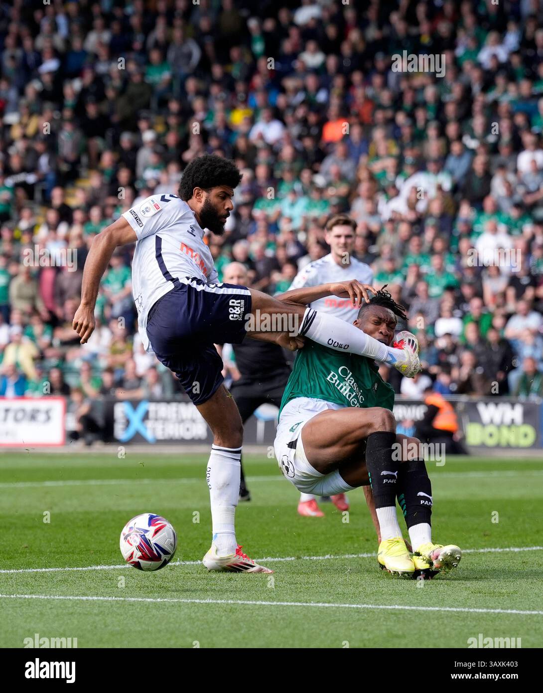 Coventry City's Ellis Simms (left) and Plymouth Argyle's Muhamed Tijani ...