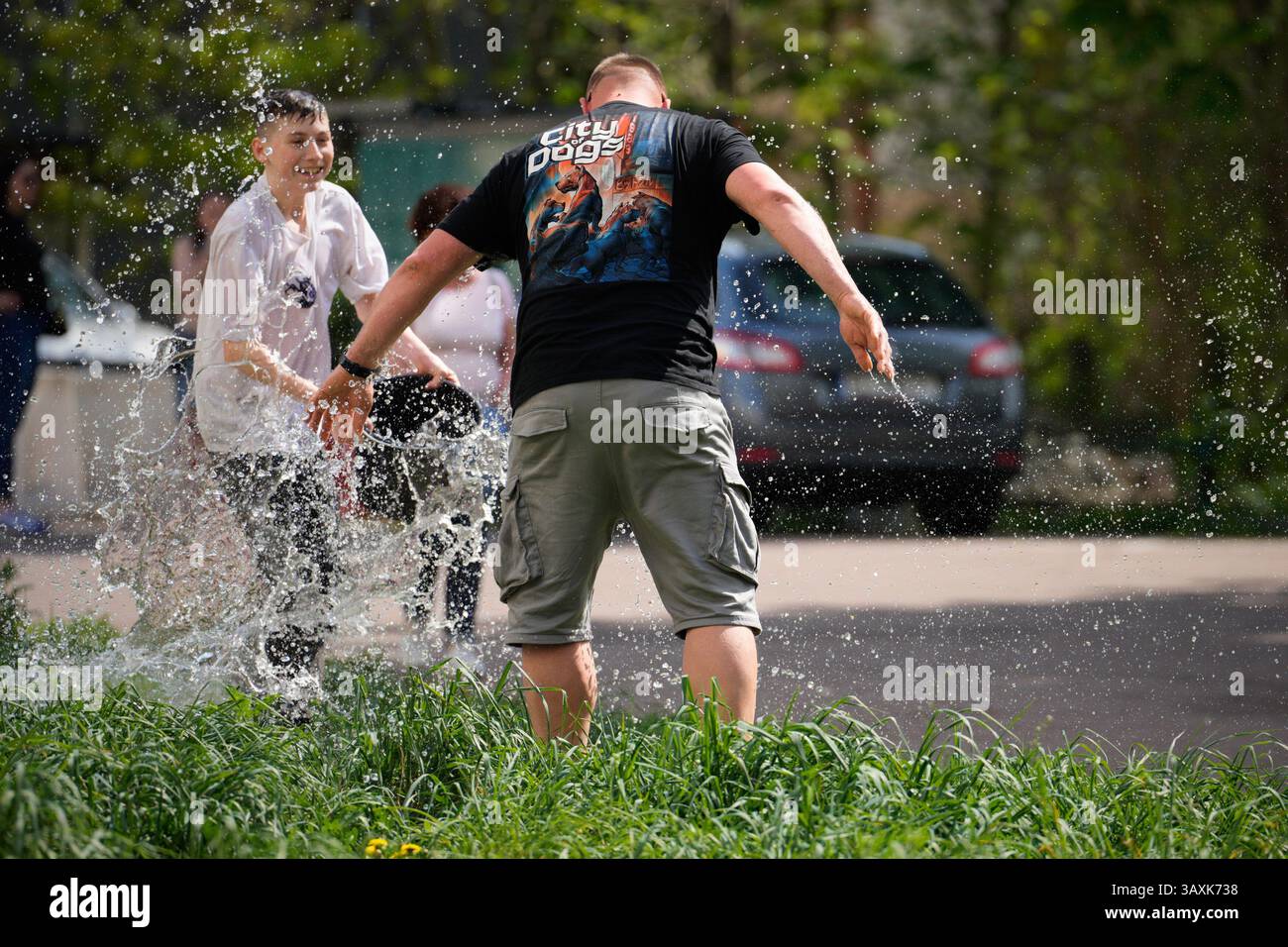 Lodz, Poland. 21st Apr, 2025. People take part in the traditional Wet ...