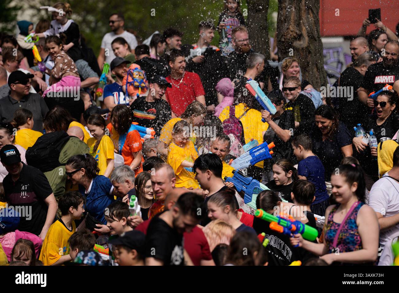 Lodz, Poland. 21st Apr, 2025. People take part in the traditional Wet ...