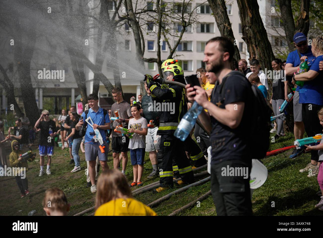 Lodz, Poland. 21st Apr, 2025. People take part in the traditional Wet ...