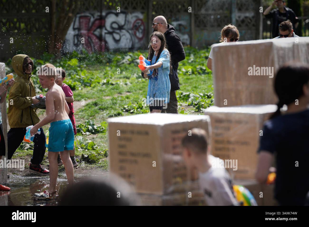 Lodz, Poland. 21st Apr, 2025. People take part in the traditional Wet ...