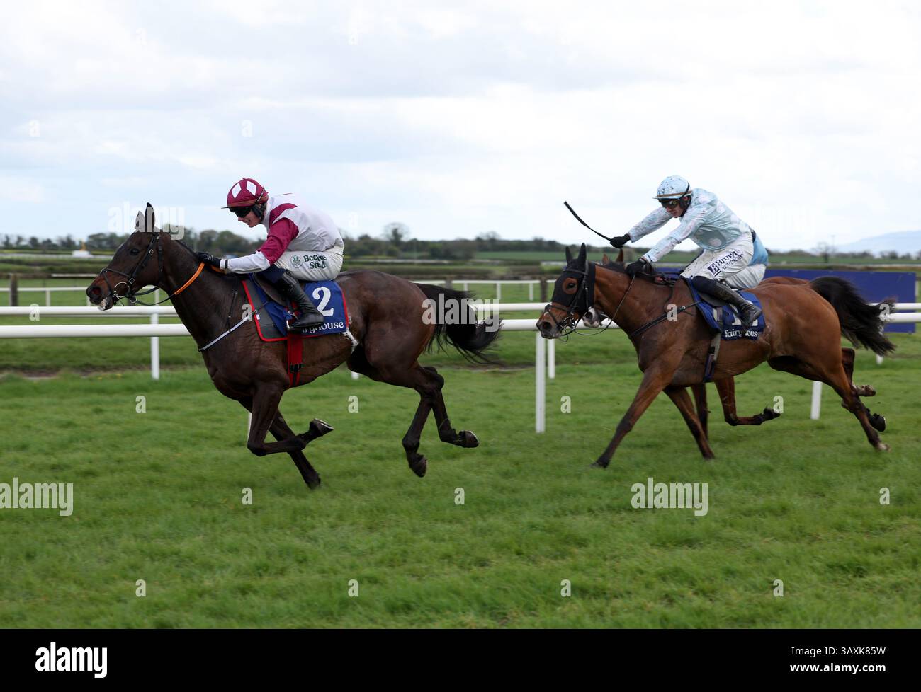 Maxxum (left) ridden by jockey Danny Gilligan on their way to winning ...
