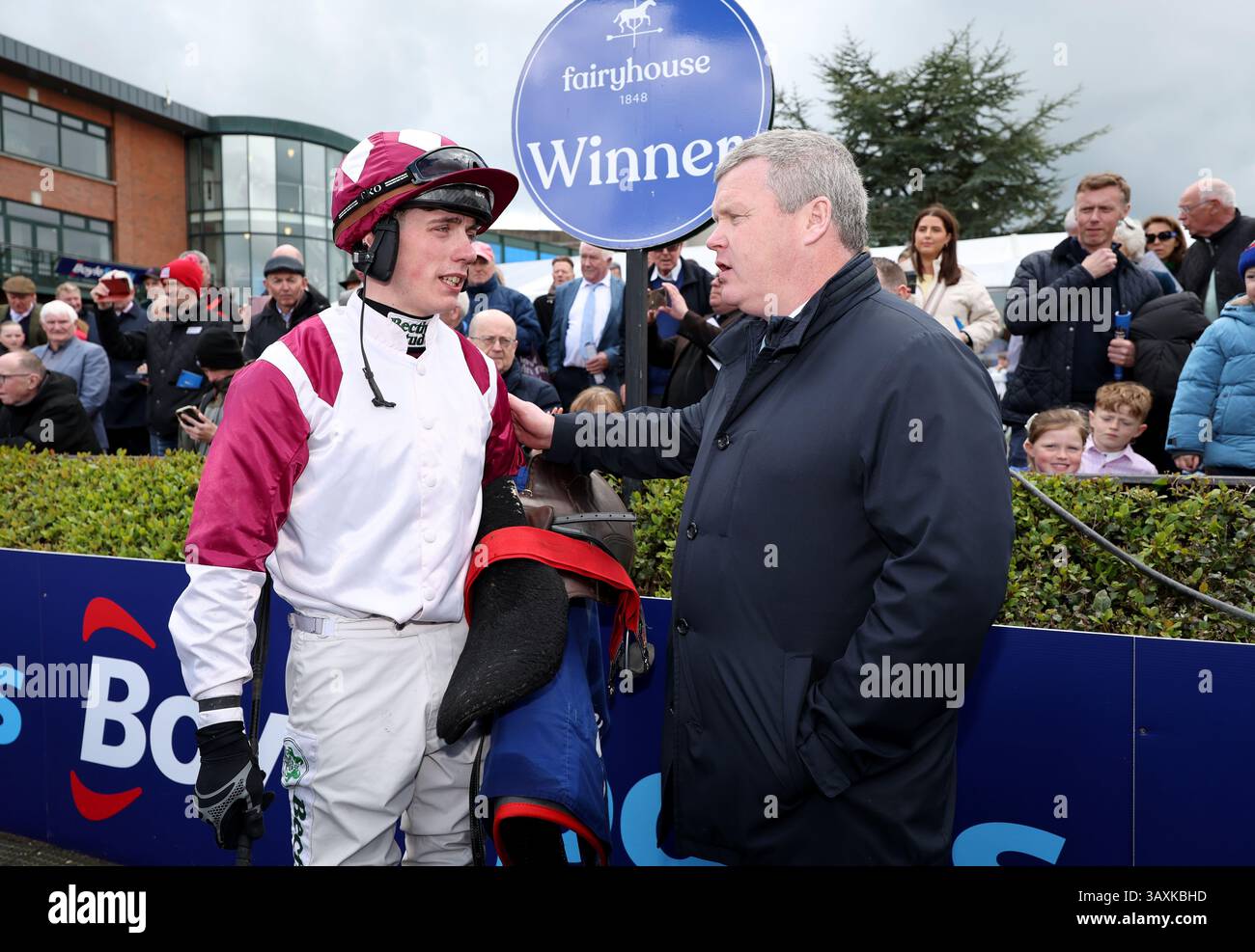 Jockey Danny Gilligan (left) speaks with trainer Gordon Elliott after he rode Maxxum to victory ...