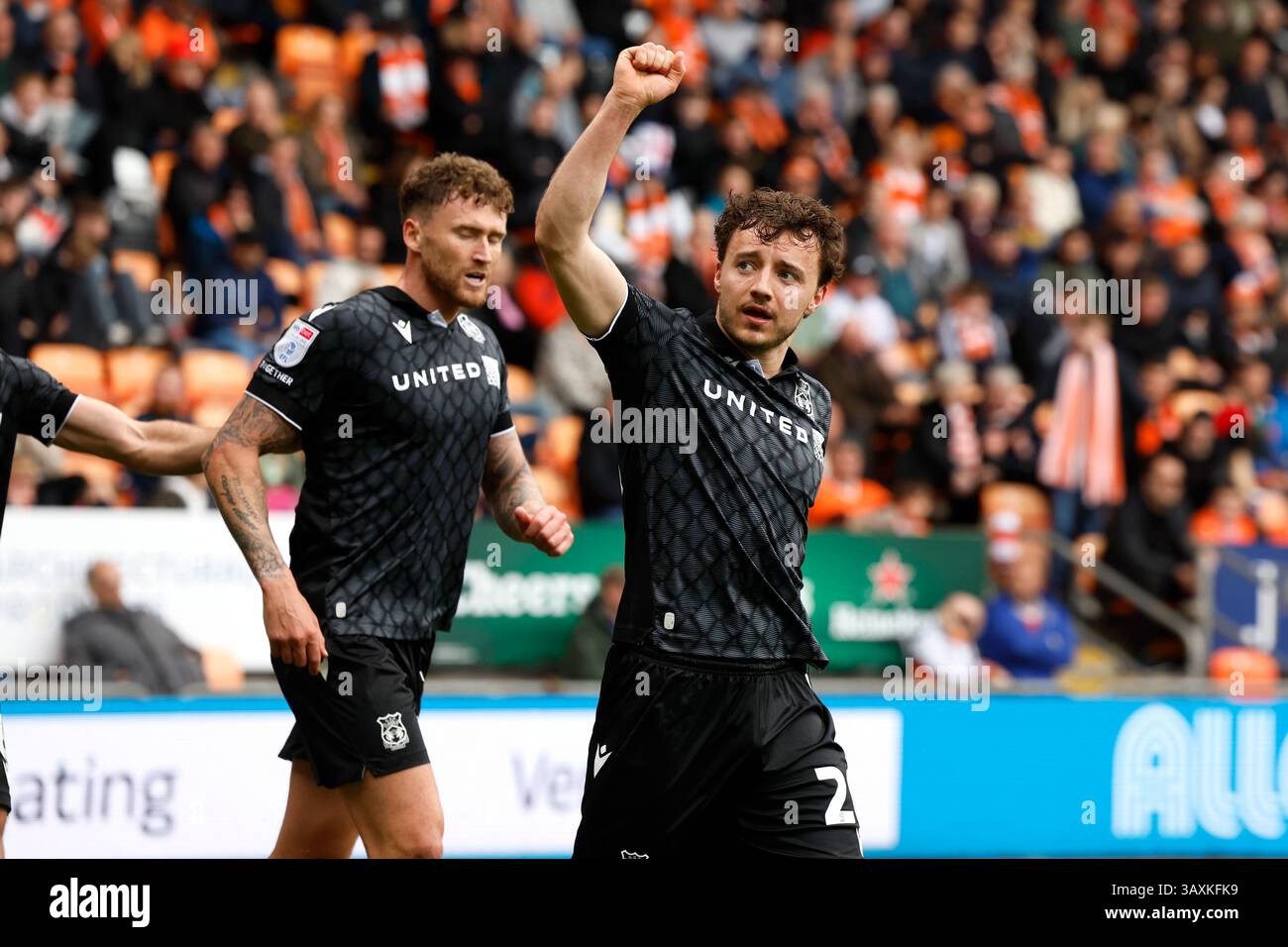Wrexham's Oliver Rathbone (right) celebrates scoring their side's ...