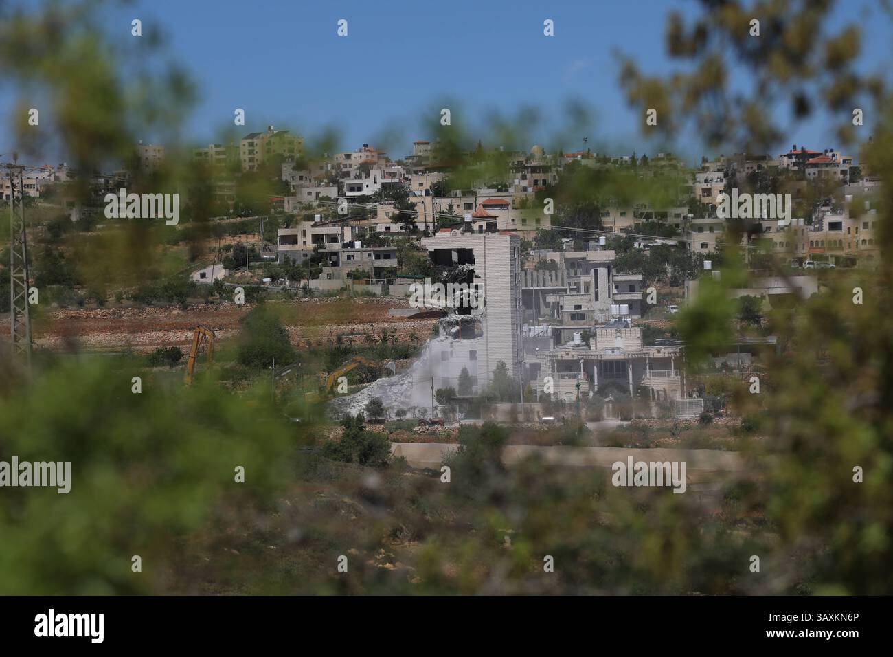 Israeli forces demolish a Palestinian-owned building that it was ...