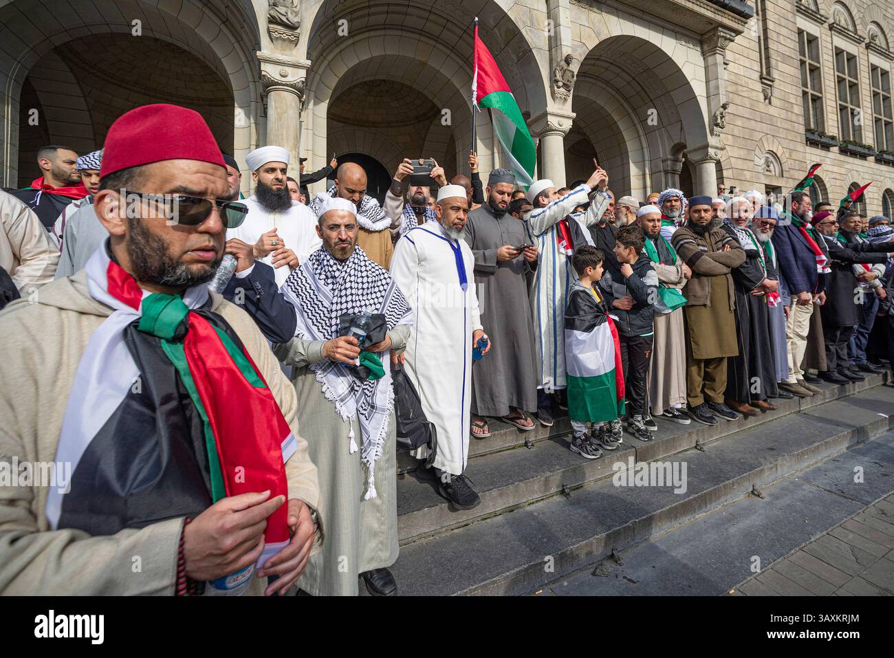 A large group of imams from all over the Netherlands congregate outside ...