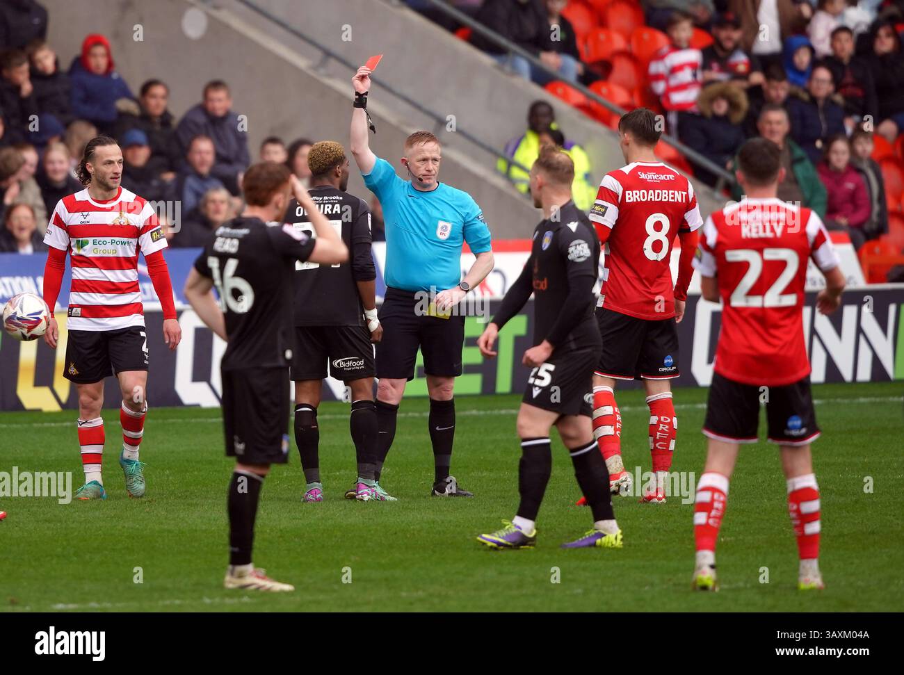 Colchester United's Owura Edwards is shown a red card by referee Alan ...