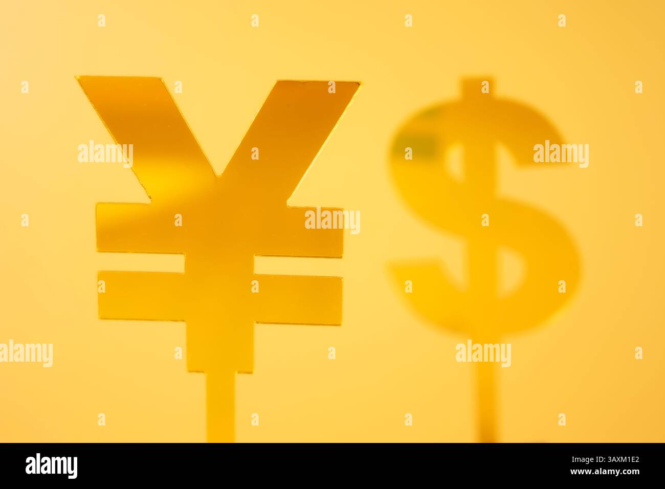 Two yellow currency symbols, the Chinese Yuan (¥) and Dollar ($), set ...