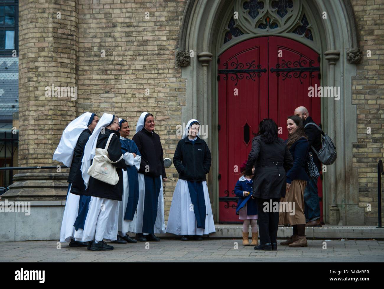 Nuns greet people outside St. Michael's Cathedral Basilica in Toronto ...