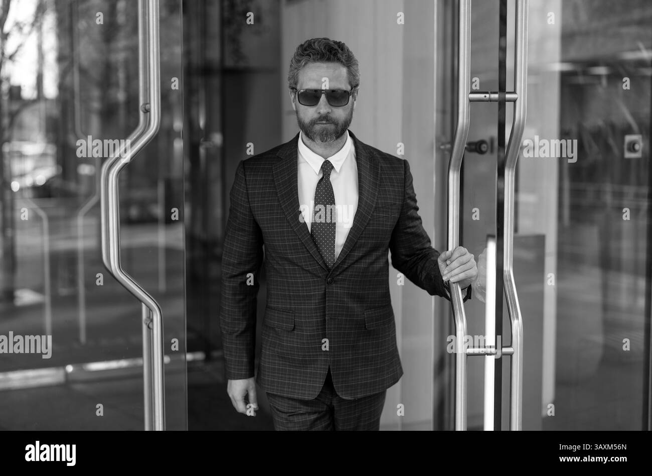 Successful businessman entering office. Mature entrepreneur at office ...