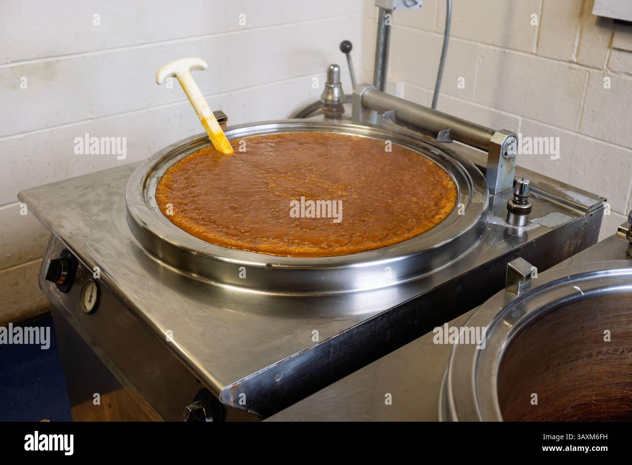 large industrial cooking pan filled with sauce in a factory Stock Photo ...